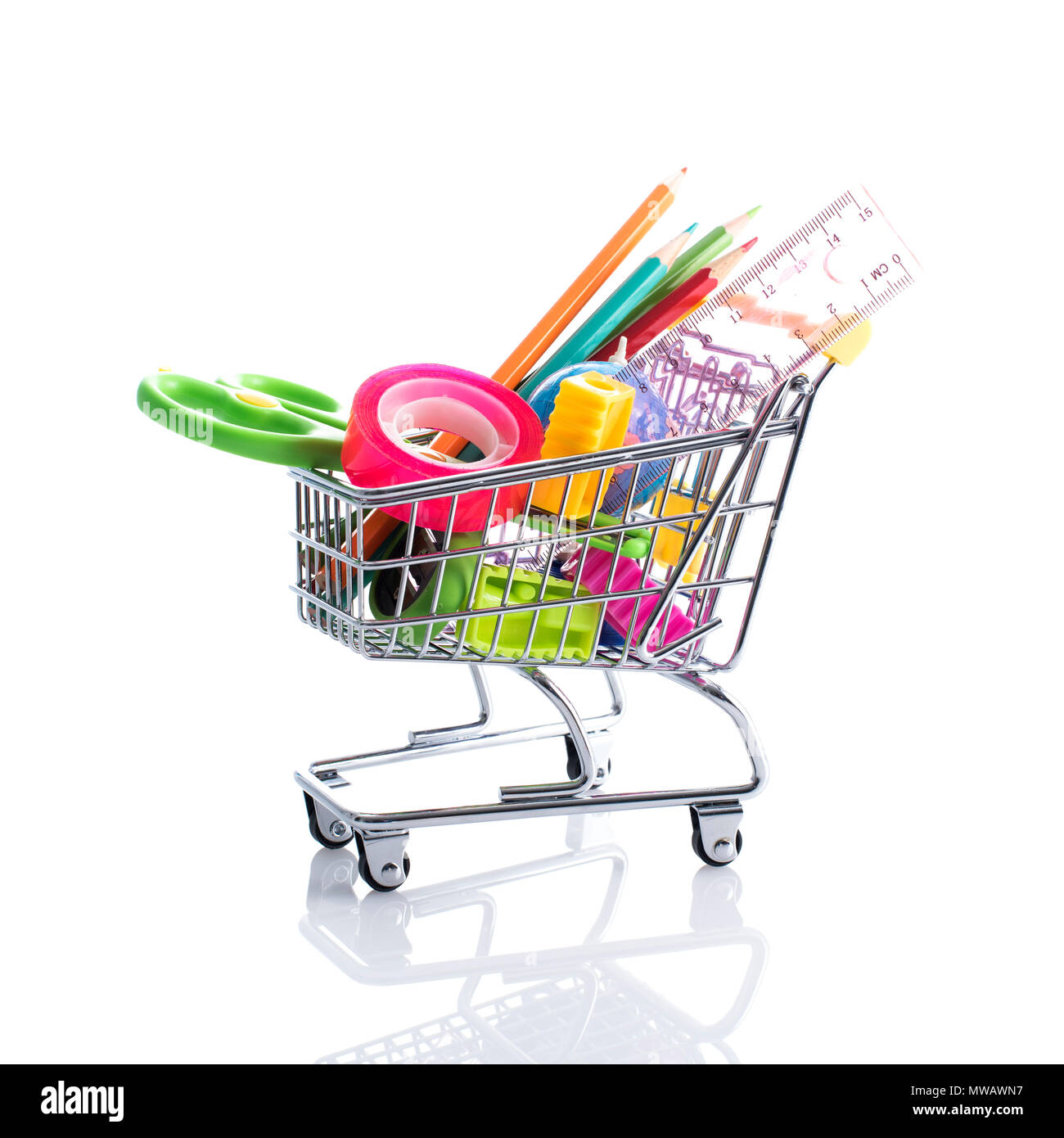 Stationery and back to school items in a miniature shopping cart on ...