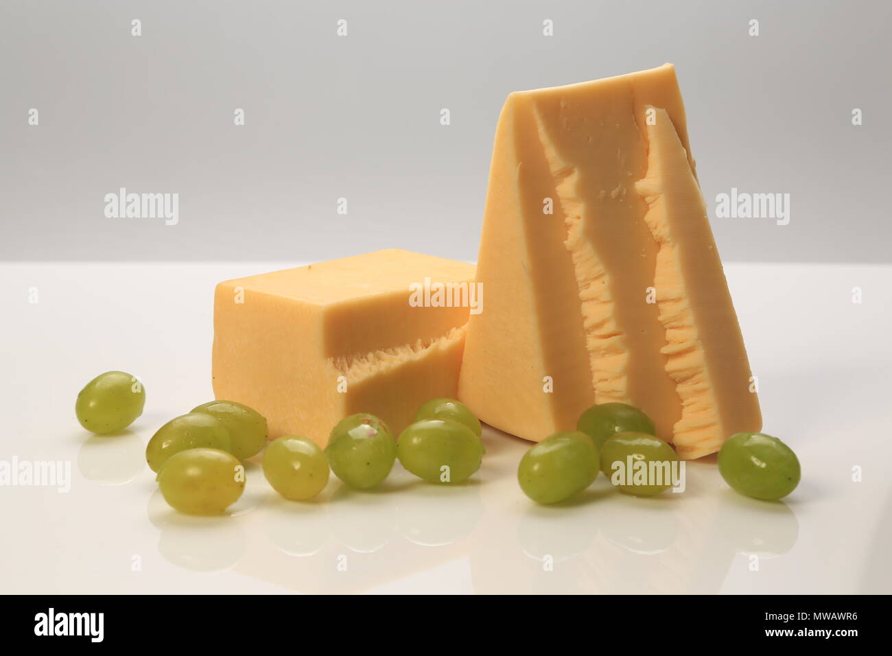 Block and triangle sliced cheese Stock Photo - Alamy
