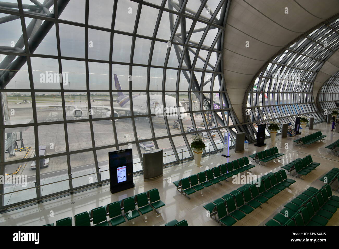 Thai Airways aircraft as seen from the departure terminal. Suvarnabhumi ...