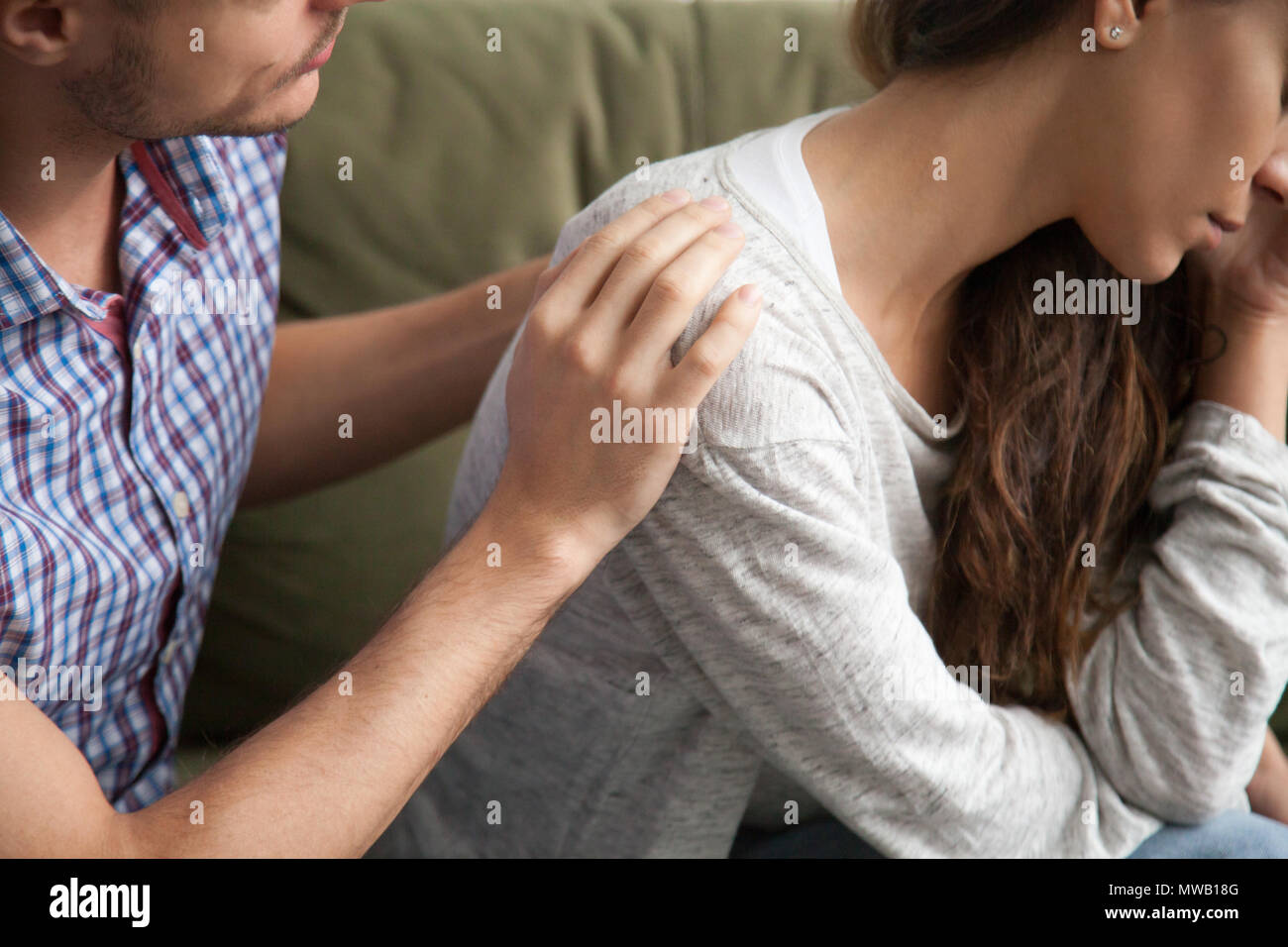 Husband consoling sad wife hi-res stock photography and images - Alamy