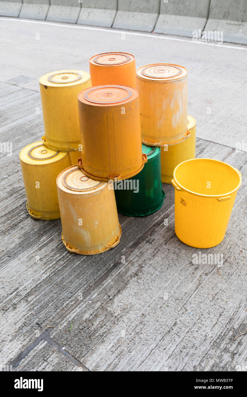 Bunch of Yellow Buckets at Street in Hong Kong Stock Photo - Alamy