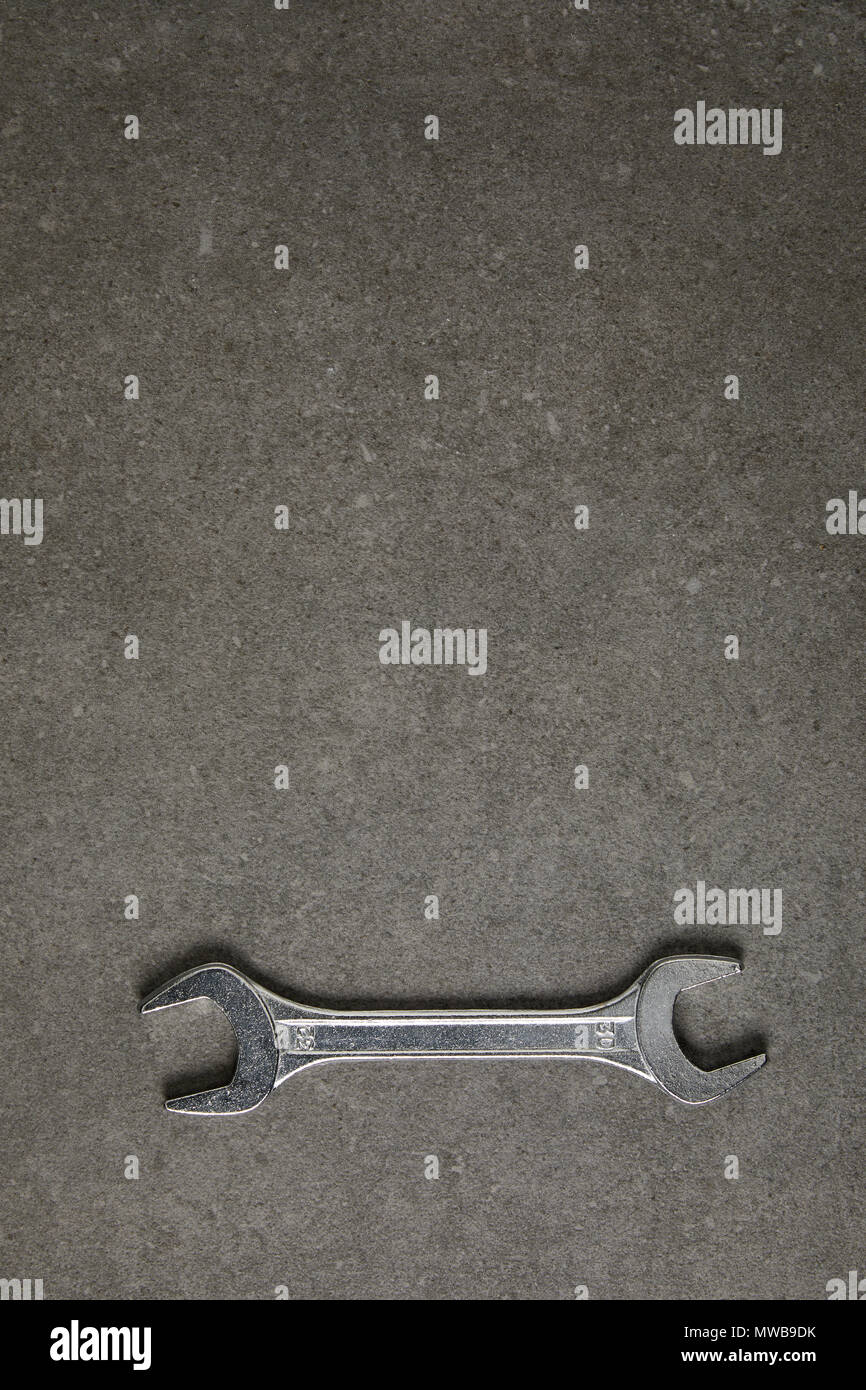 elevated view of spanner on gray surface Stock Photo - Alamy