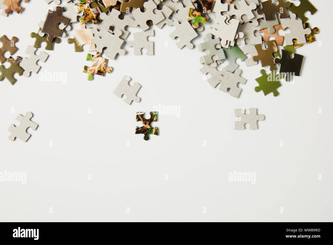 top view of jigsaw puzzle pieces on grey Stock Photo - Alamy