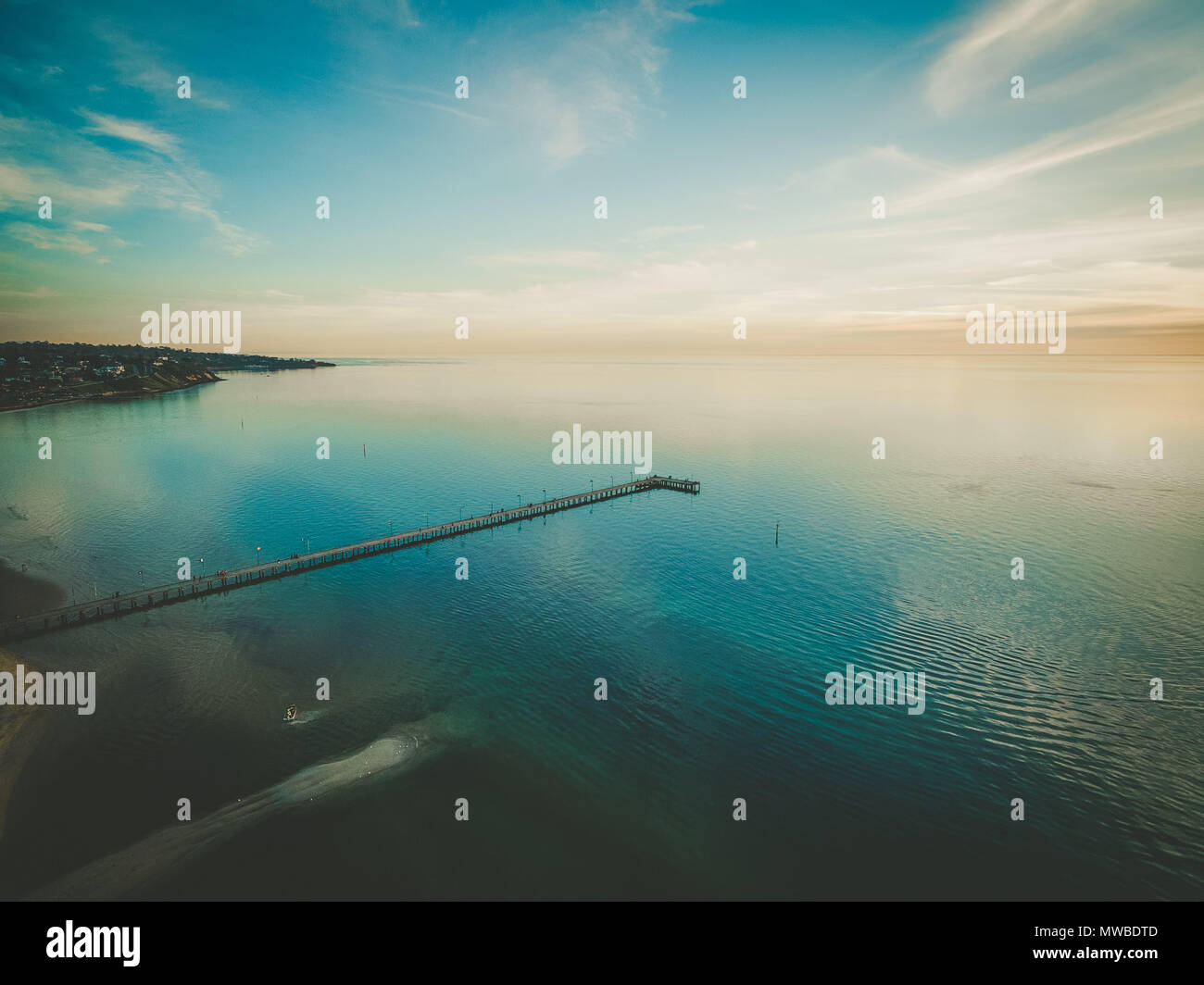 Ocean bay pier at sunset aerial view in faded colors Stock Photo - Alamy