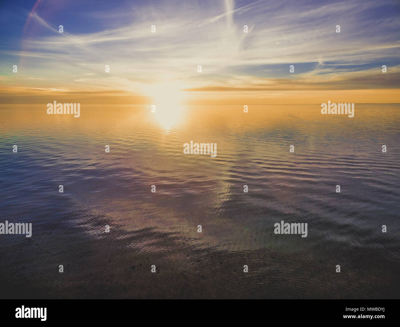 Minimal seascape glowing sun hi-res stock photography and images - Alamy