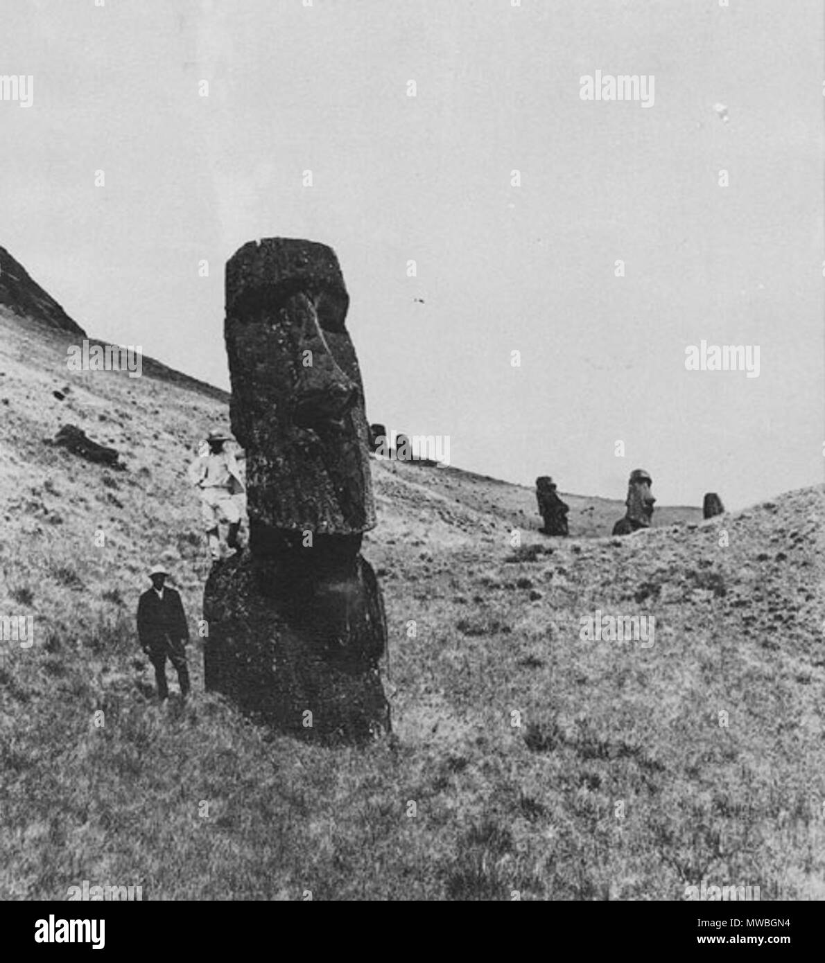 . Anonymous photograph: Easter Island, two Europeans and statue . circa ...