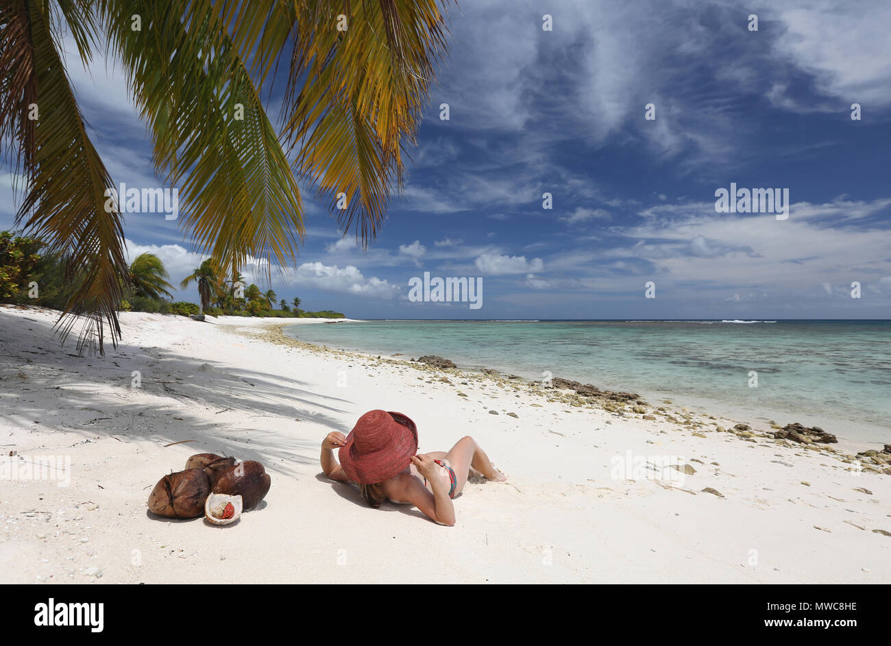 Woman relaxing on a tropical beach hi-res stock photography and images ...