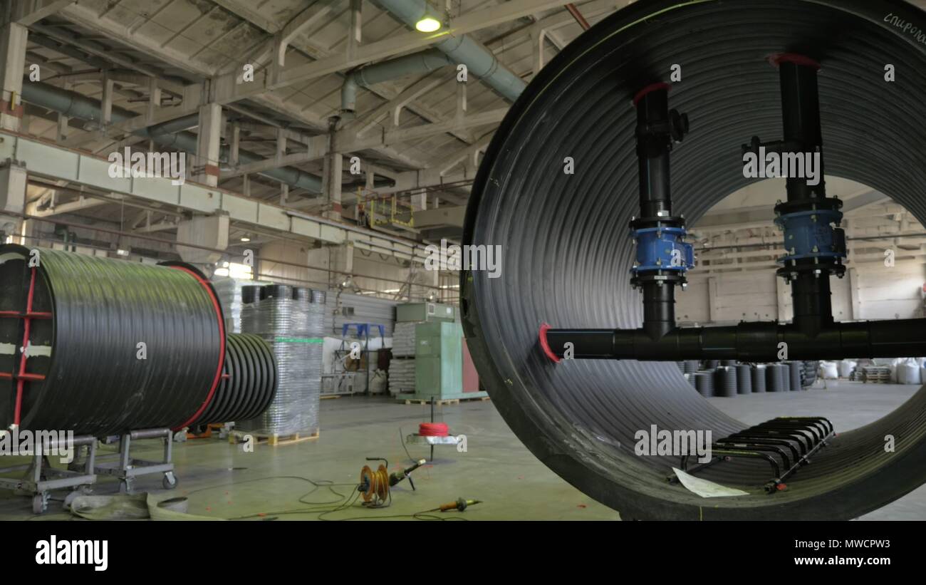 Manufacture of plastic water pipes. View of the factory floor. Finish ...