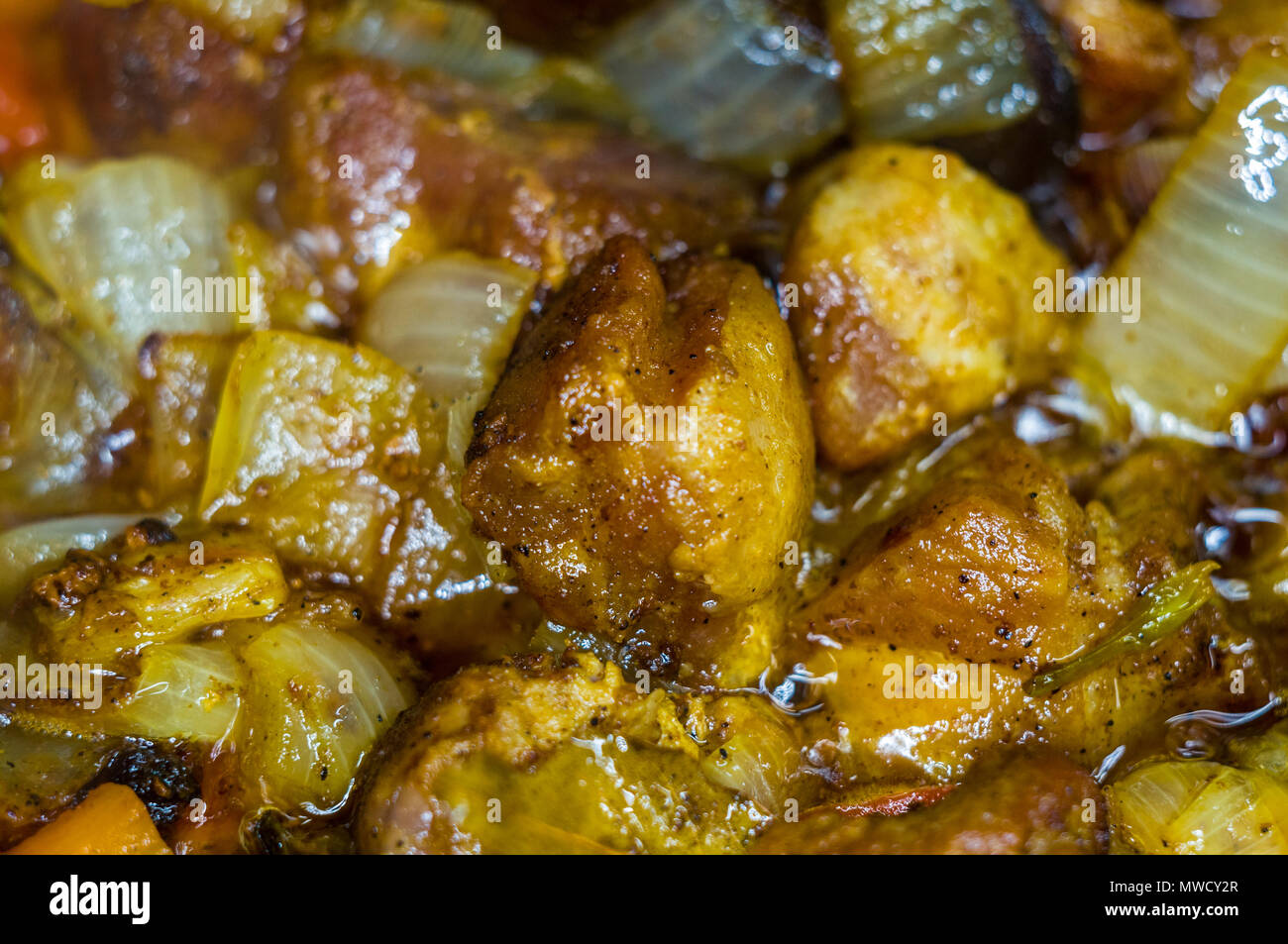 Roast meat, onions, carrots and spices, boiling in oil, homemade ...