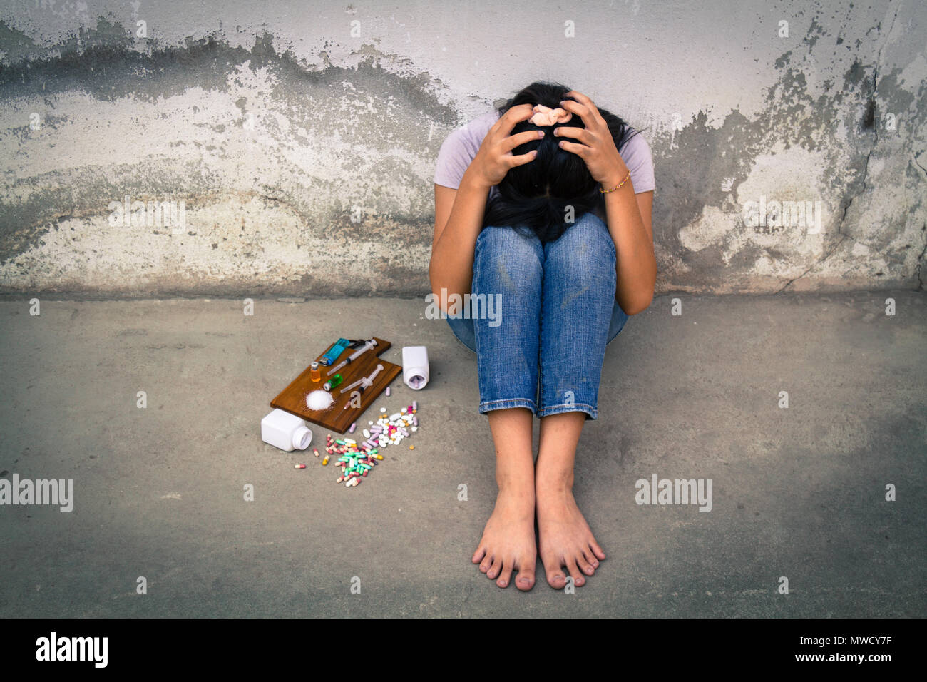 Concept Asia young girl is sad by drug addiction. Drug addiction in ...