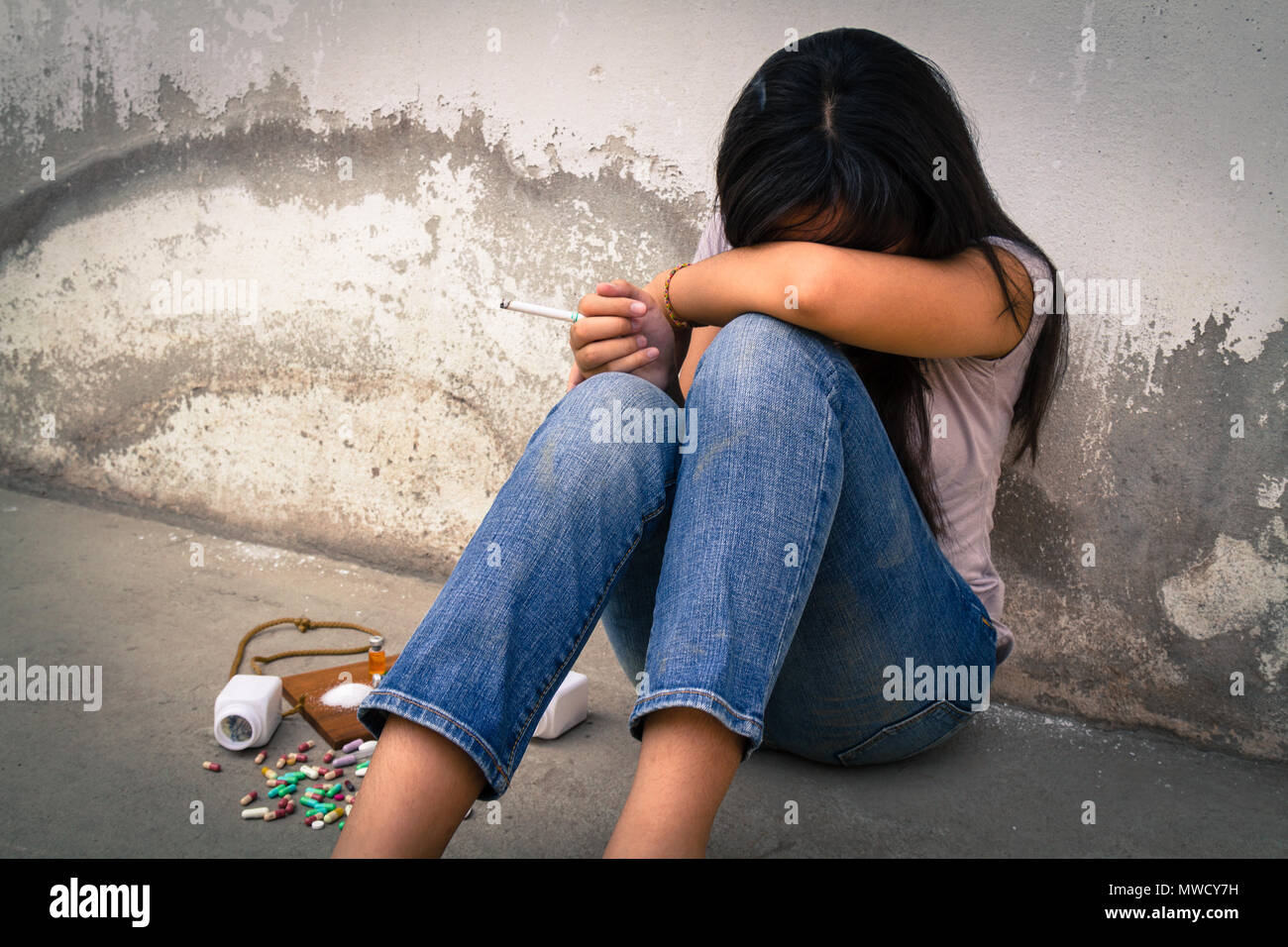 Concept Asia young girl is sad by drug addiction. Drug addiction in ...