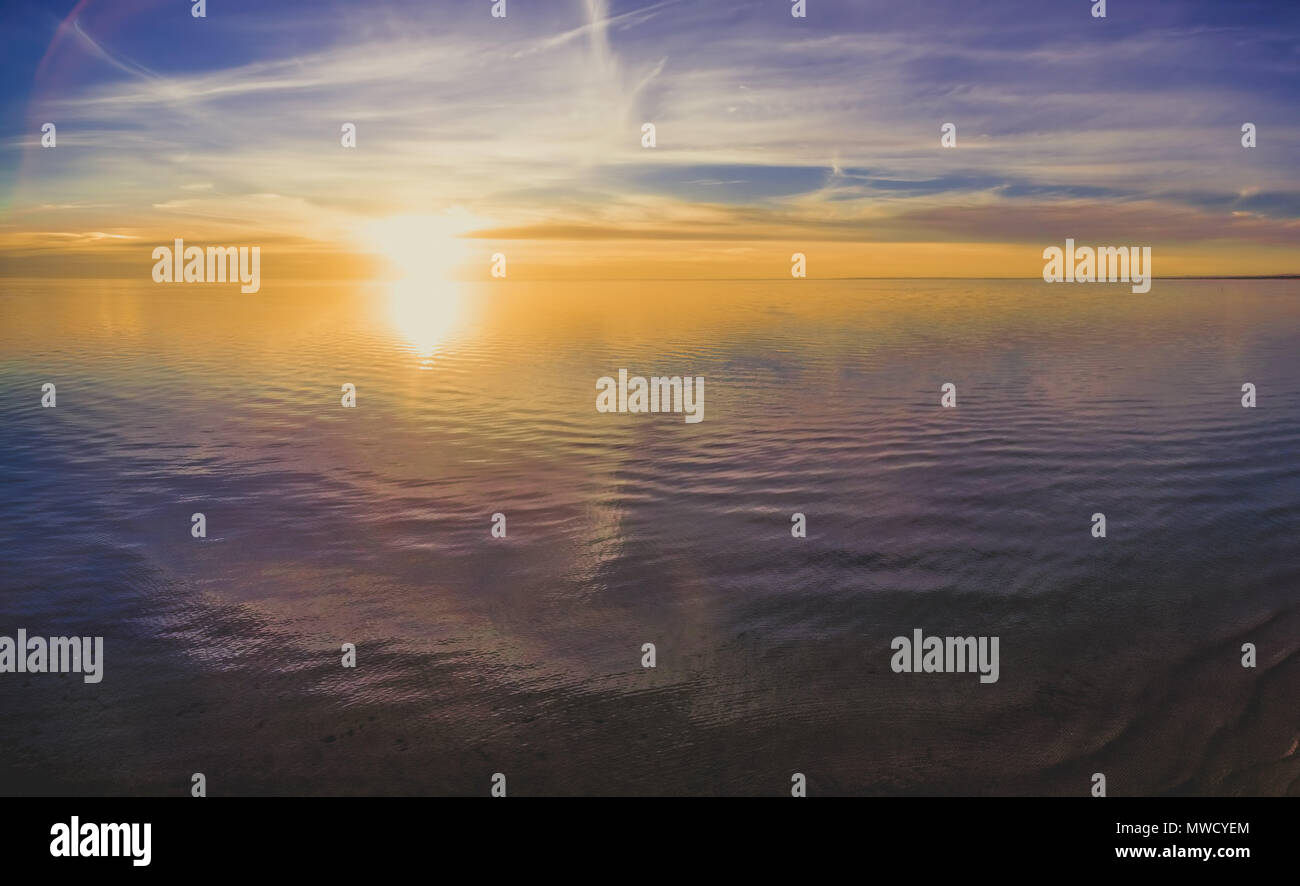 Beautiful aerial panorama of sun setting over sea Stock Photo - Alamy