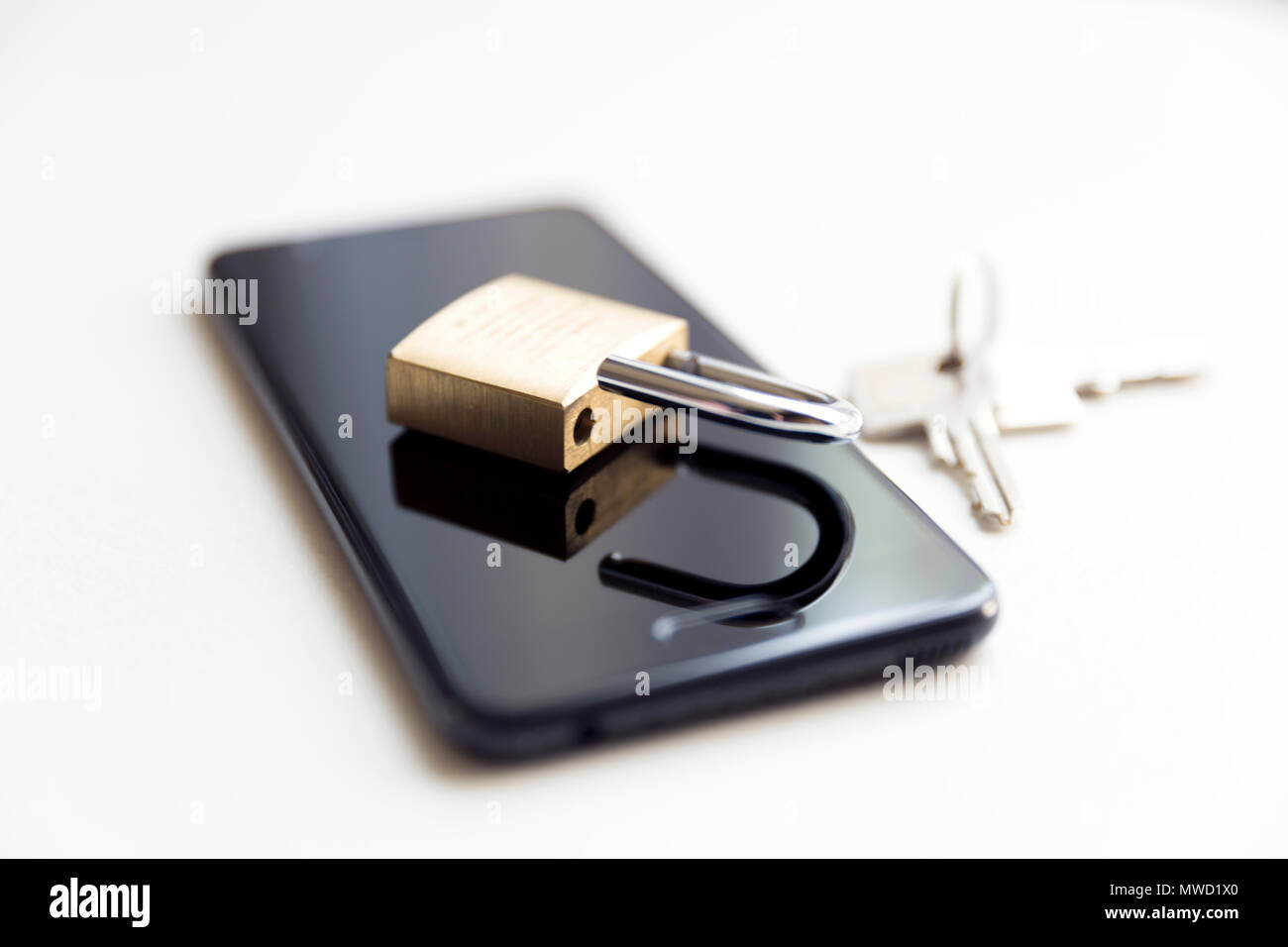 Cellphone data security - lock, keys and phone on white background ...