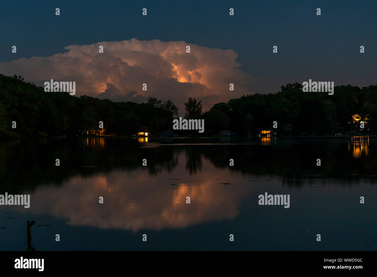 Prairieville, Michigan - Lightning from a distant storm is reflected in ...