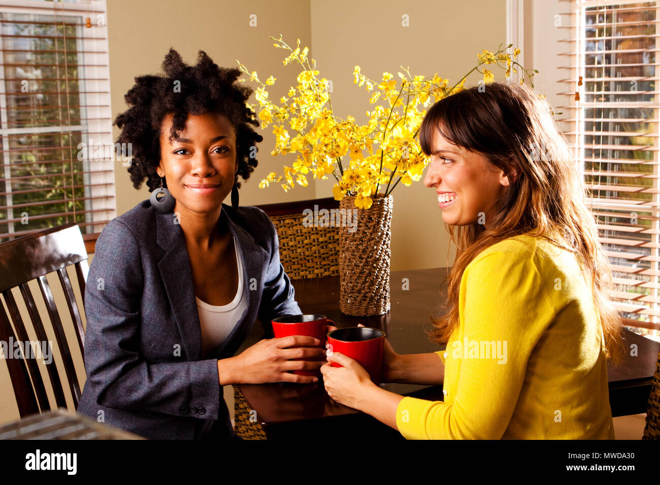 Diverse group of friends talking and laughing Stock Photo - Alamy