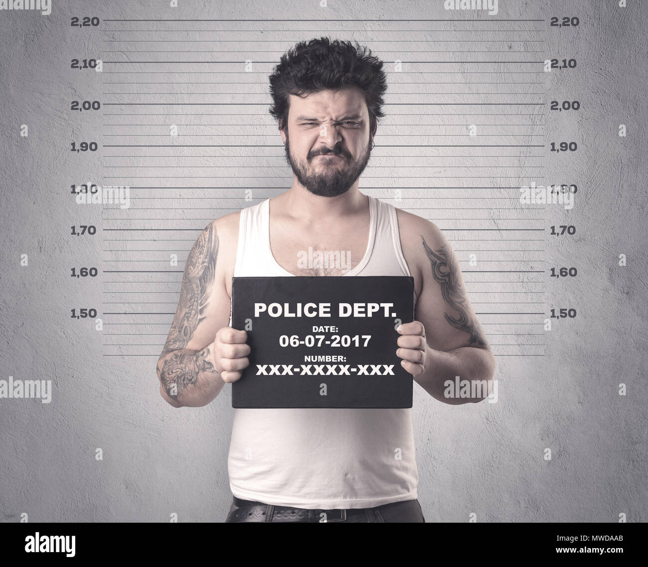 Caught gangster in jail with table on his hand Stock Photo - Alamy
