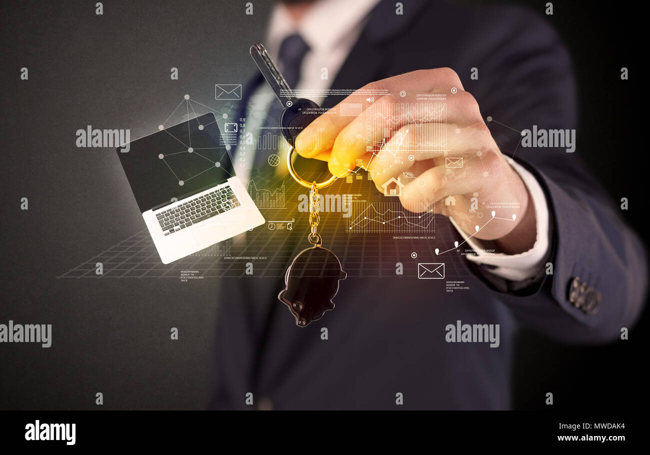 Businessman in suit holding keys with statistics, graphs and icons ...