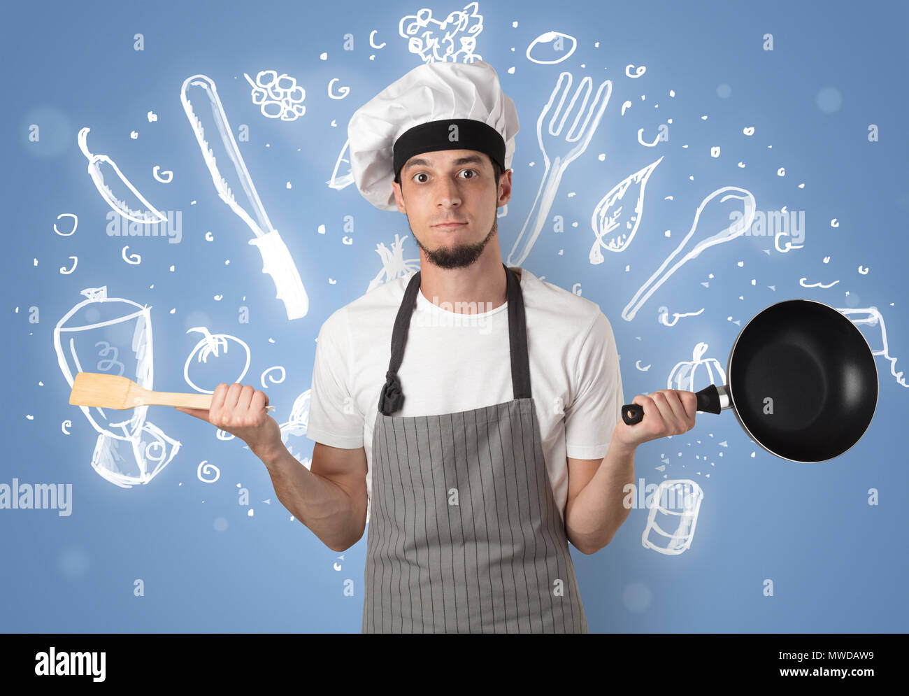 Young cook with kitchen instruments and drawn recipe concept on ...