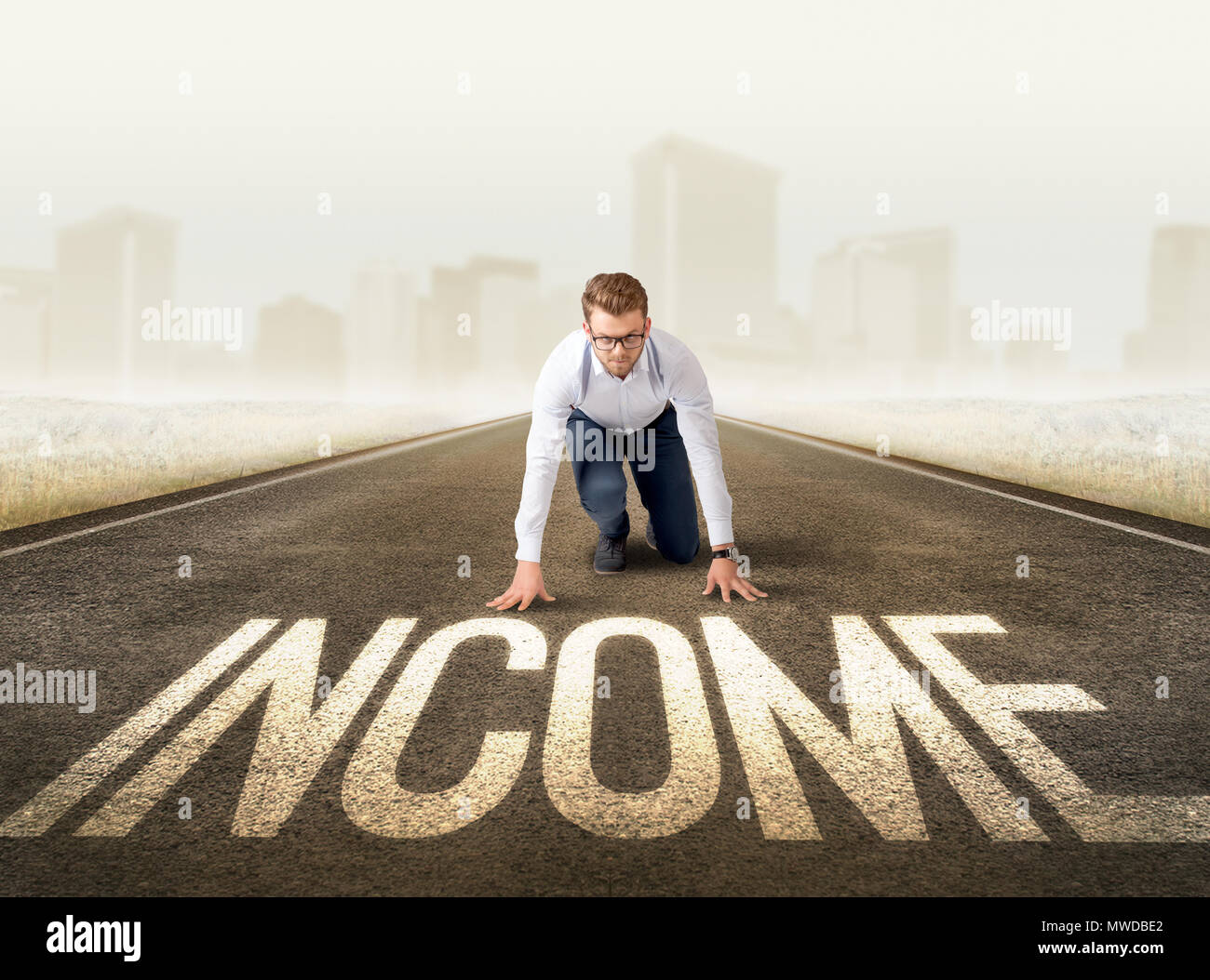 Young determined businessman kneeling before income sign Stock Photo ...