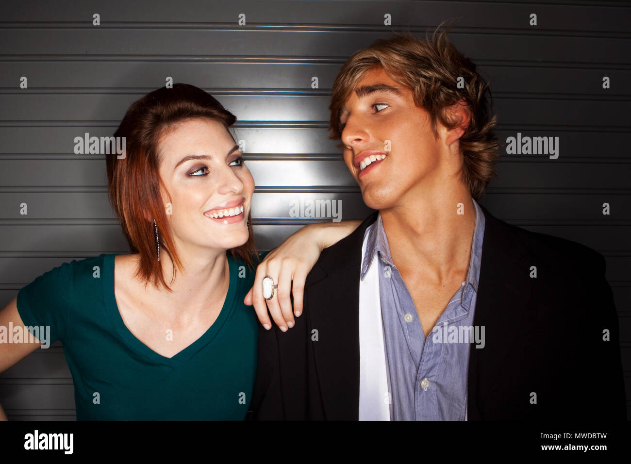 Young couple laughing and hanging out Stock Photo - Alamy