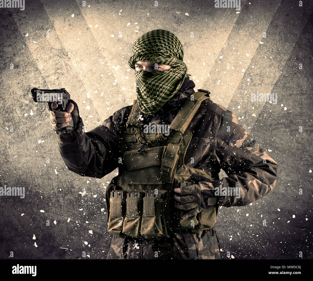 Portrait of a dangerous masked armed soldier with grungy light ...