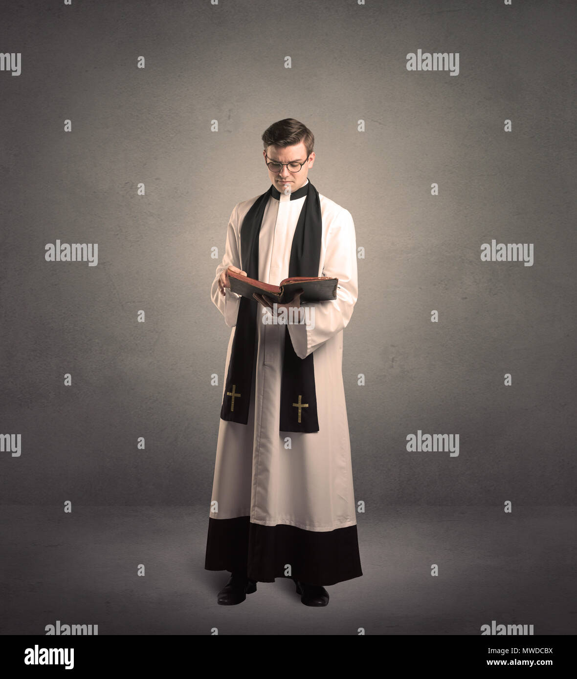 young priest in giving his blessing Stock Photo - Alamy