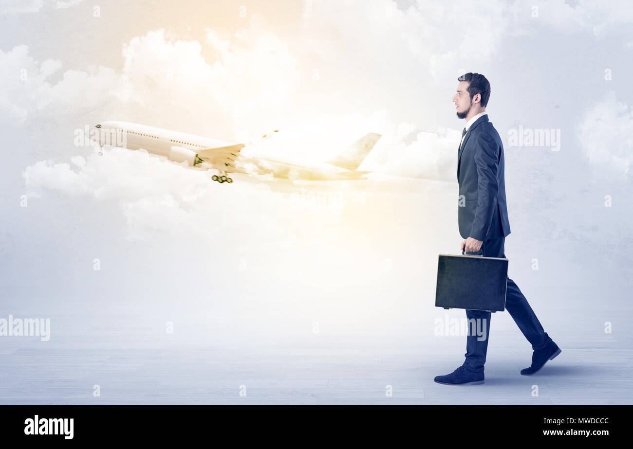 Elegant businessman going somewhere with briefcase and airplane on the ...