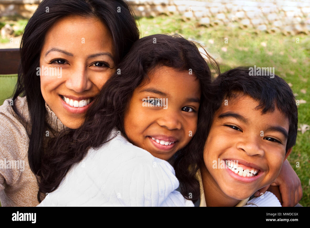 Biracial Family Laughing And Smiling Outside Stock Photo Alamy