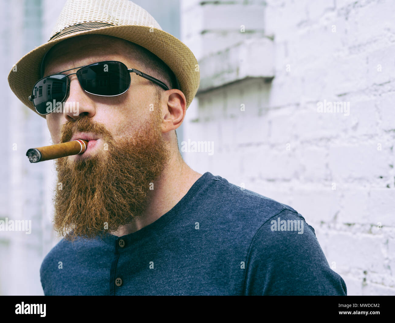 Bearded man smoking cigar outdoor hi-res stock photography and images ...