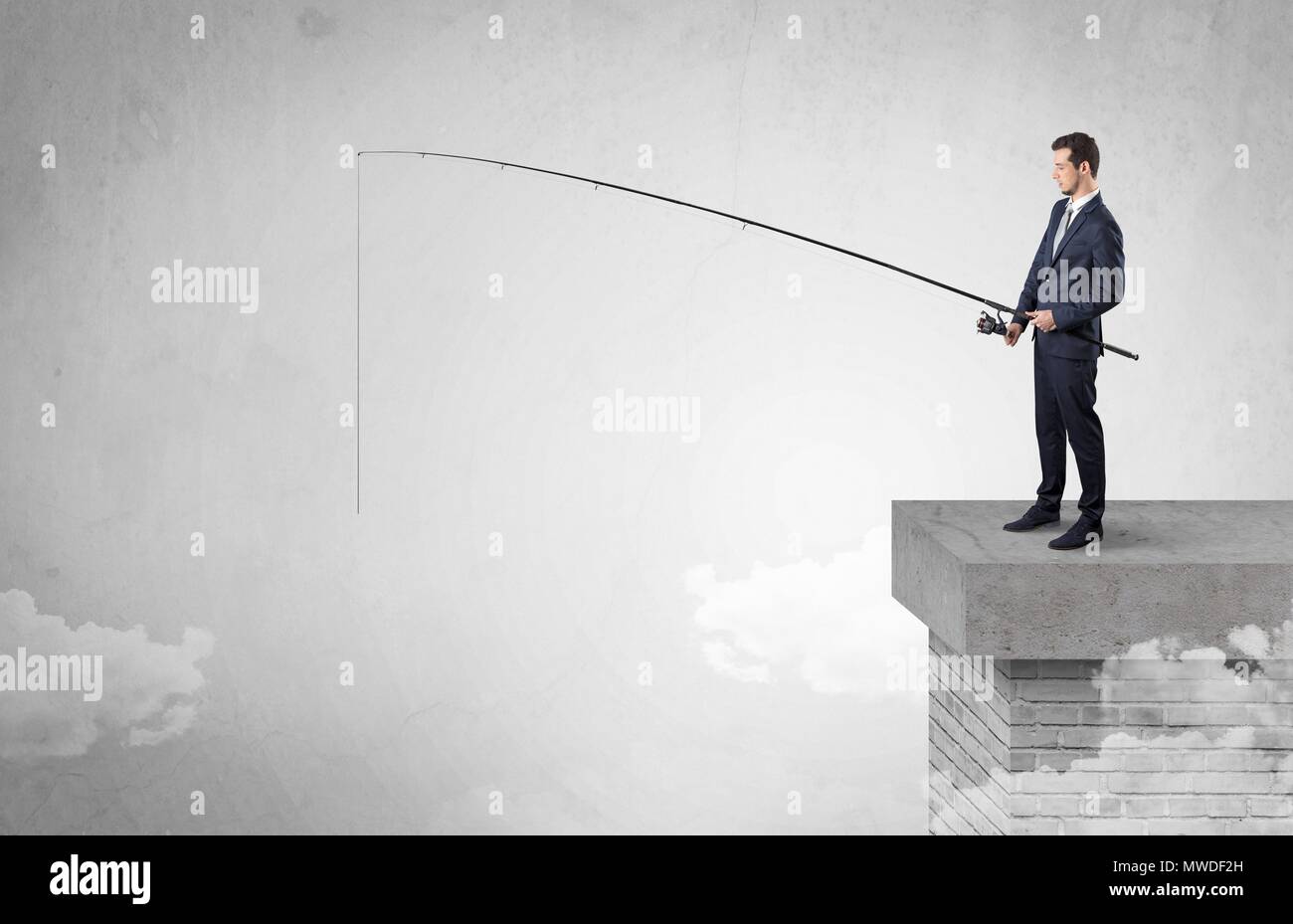 Businessman fishing nothing from the cloud with free copyspace Stock ...