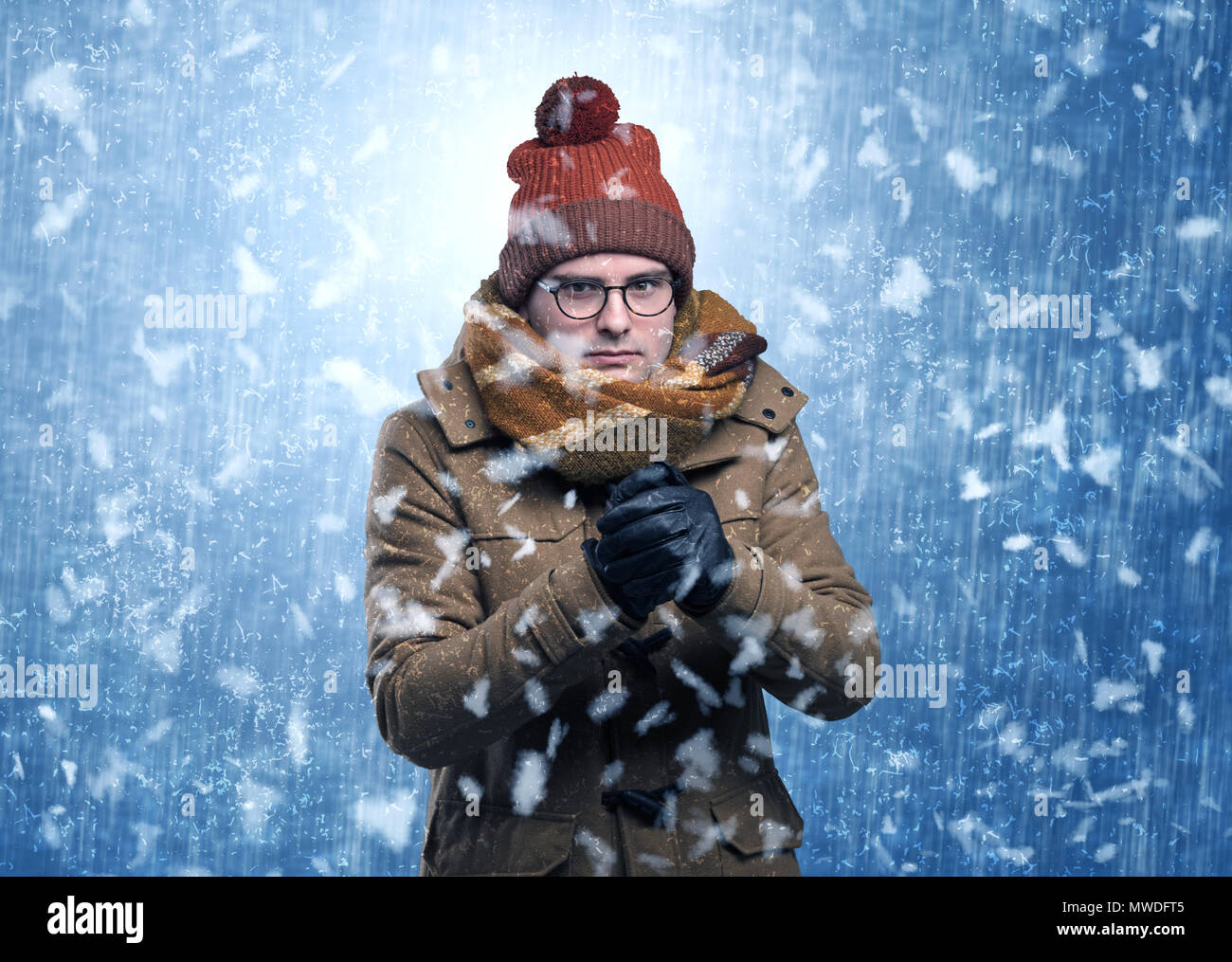 Handsome young boy shivering and trembling at snowstorm concept Stock ...