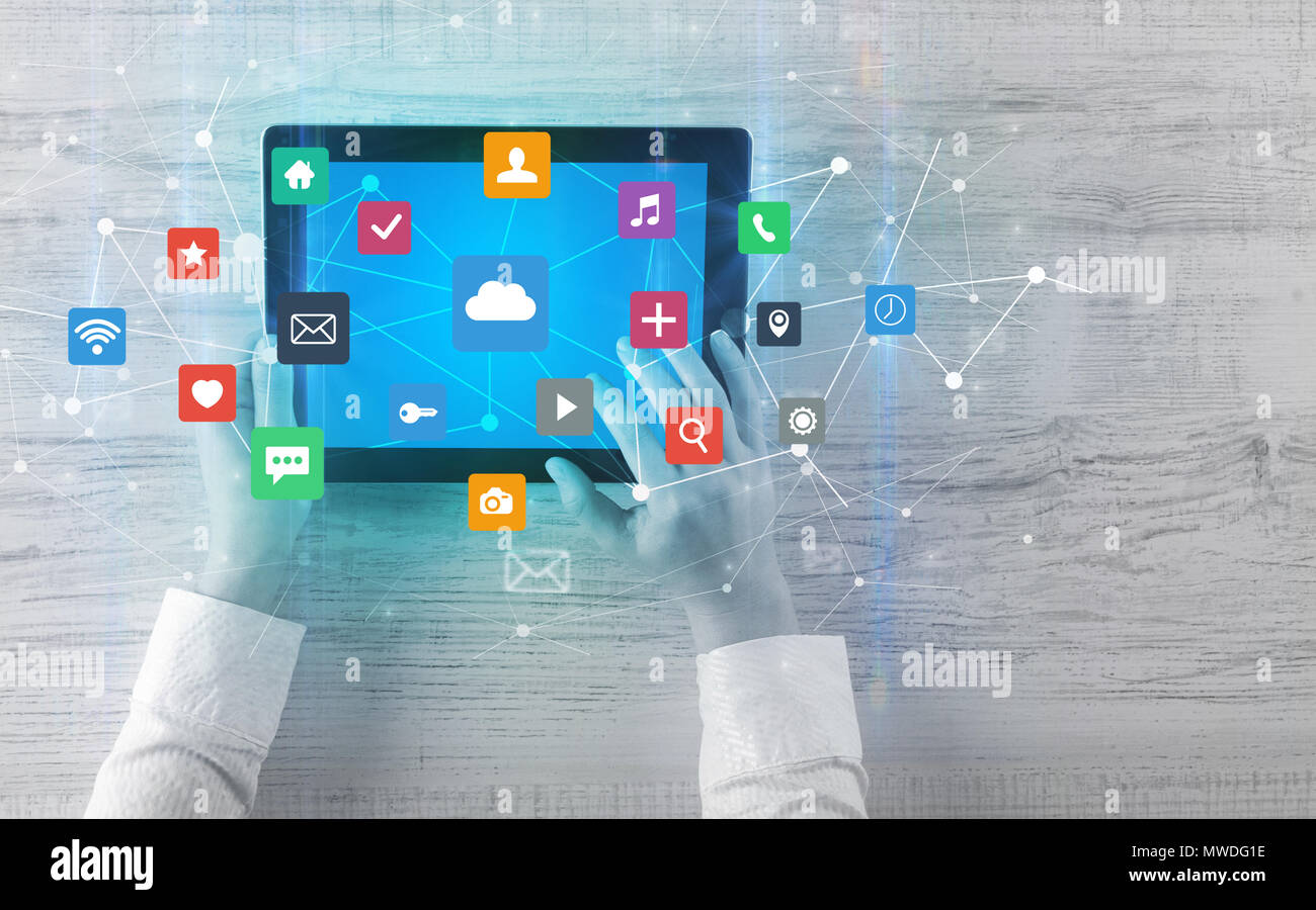Hand touching multitask tablet with cloud wifi message social media ...