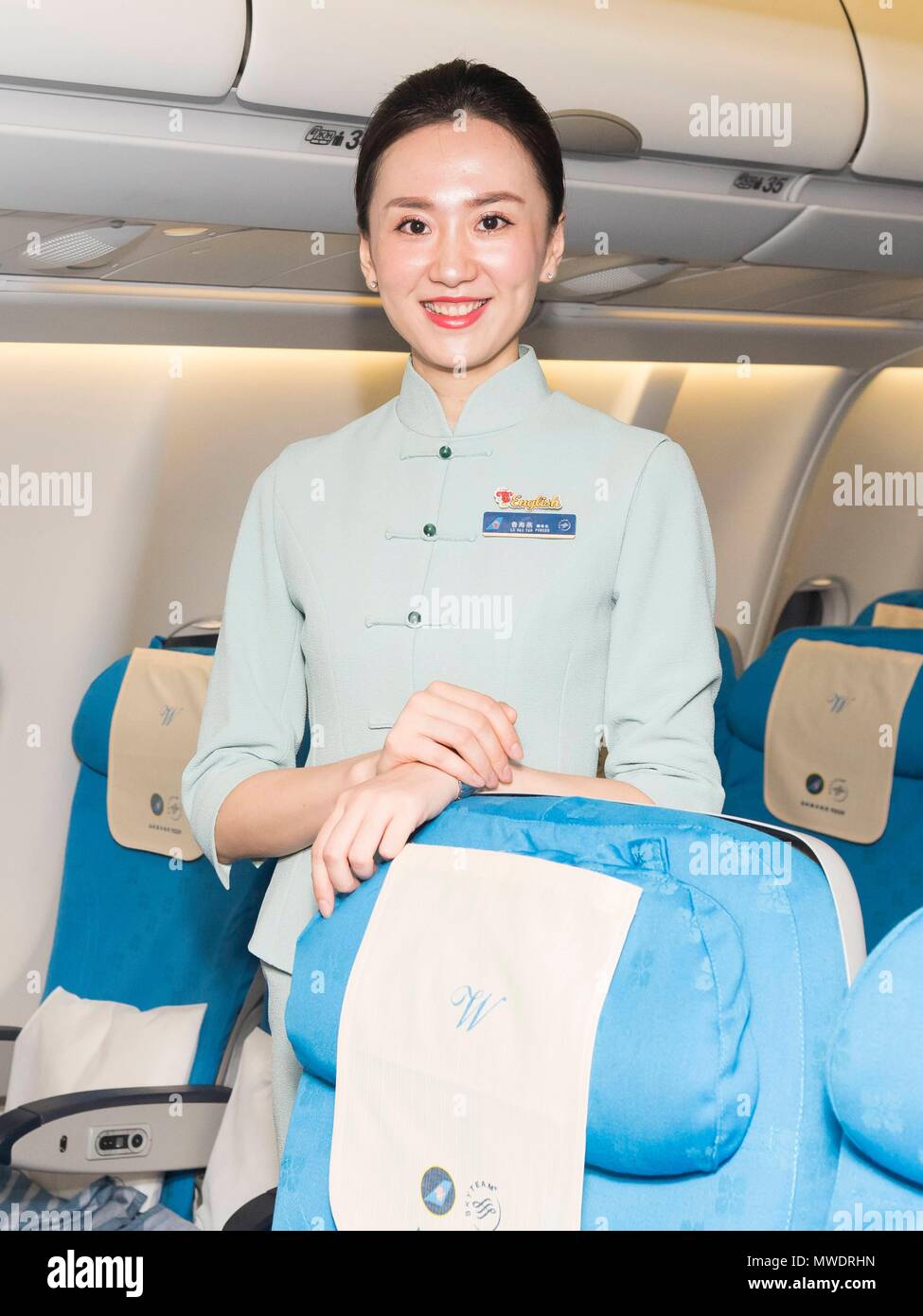 Cabin crew at the New China Southern Airlines flight from London to ...