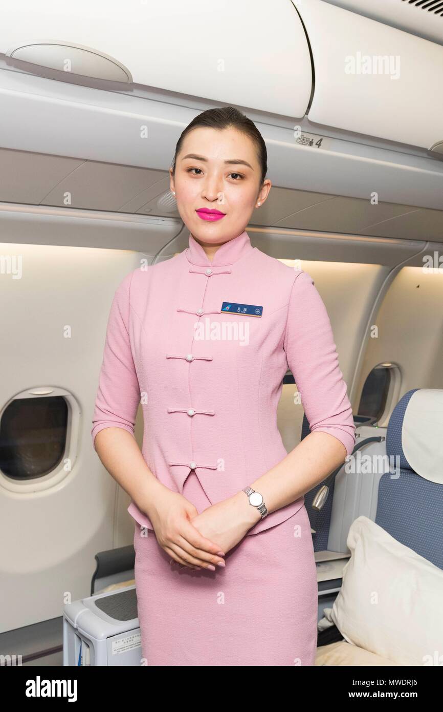 Cabin crew at the New China Southern Airlines flight from London to ...