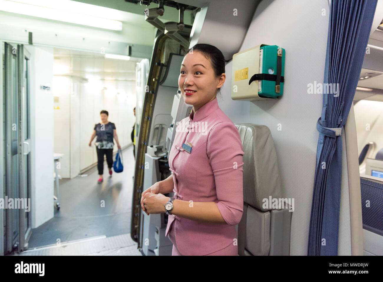 Cabin crew at the New China Southern Airlines flight from London to ...