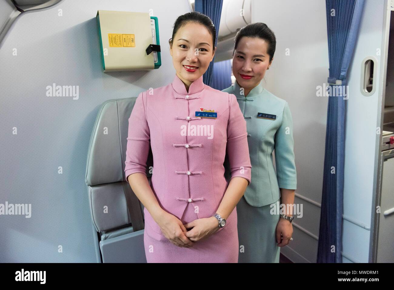 Cabin crew at the New China Southern Airlines flight from London to ...