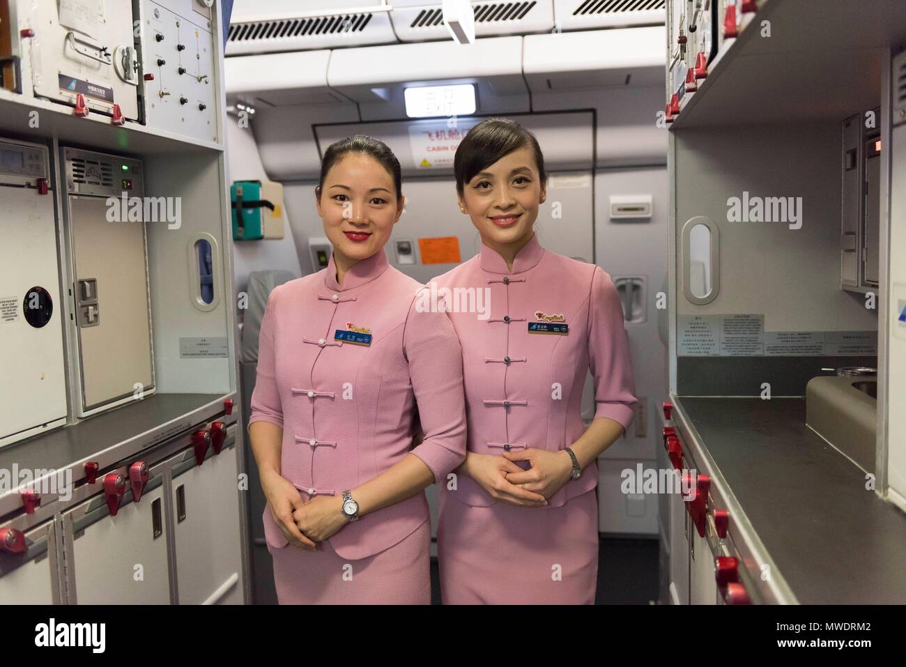 Cabin crew at the New China Southern Airlines flight from London to ...