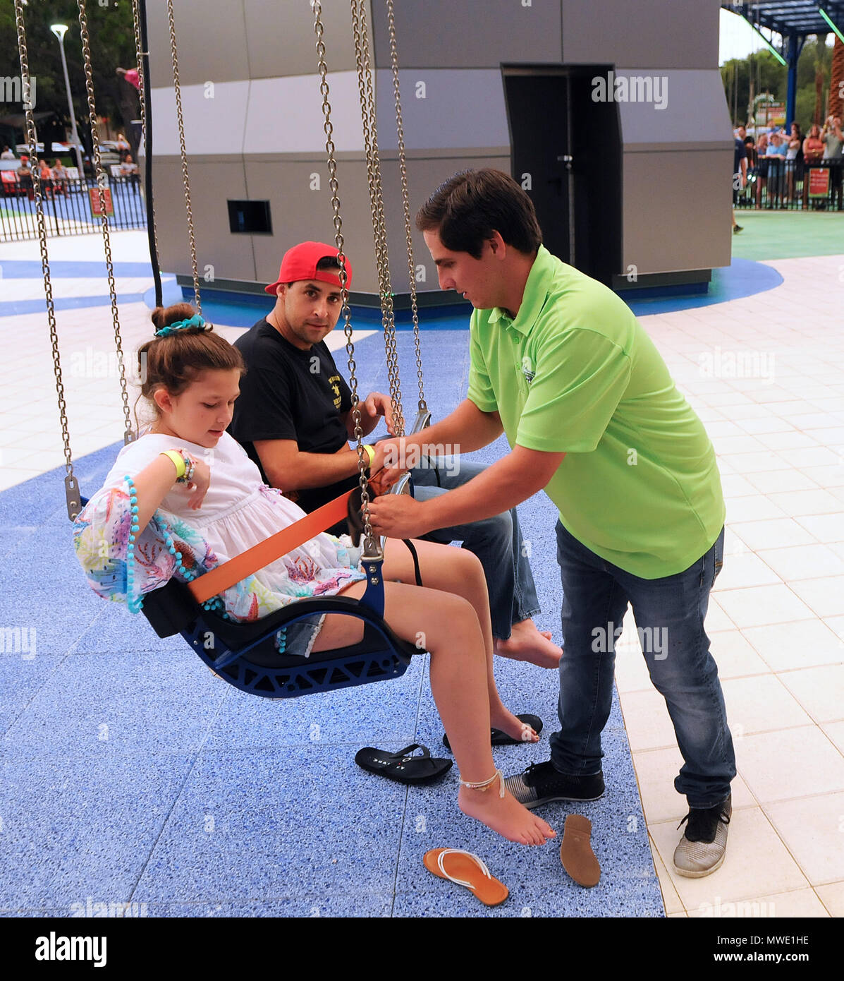 Florida, USA. 1st June 2018. An attendant fastens a seat belt for a ...