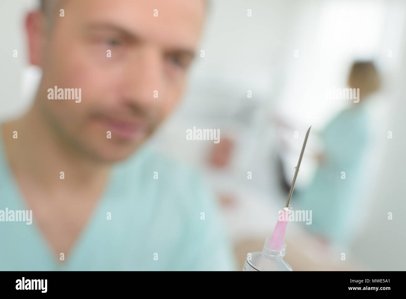 doctors injection a patient Stock Photo - Alamy