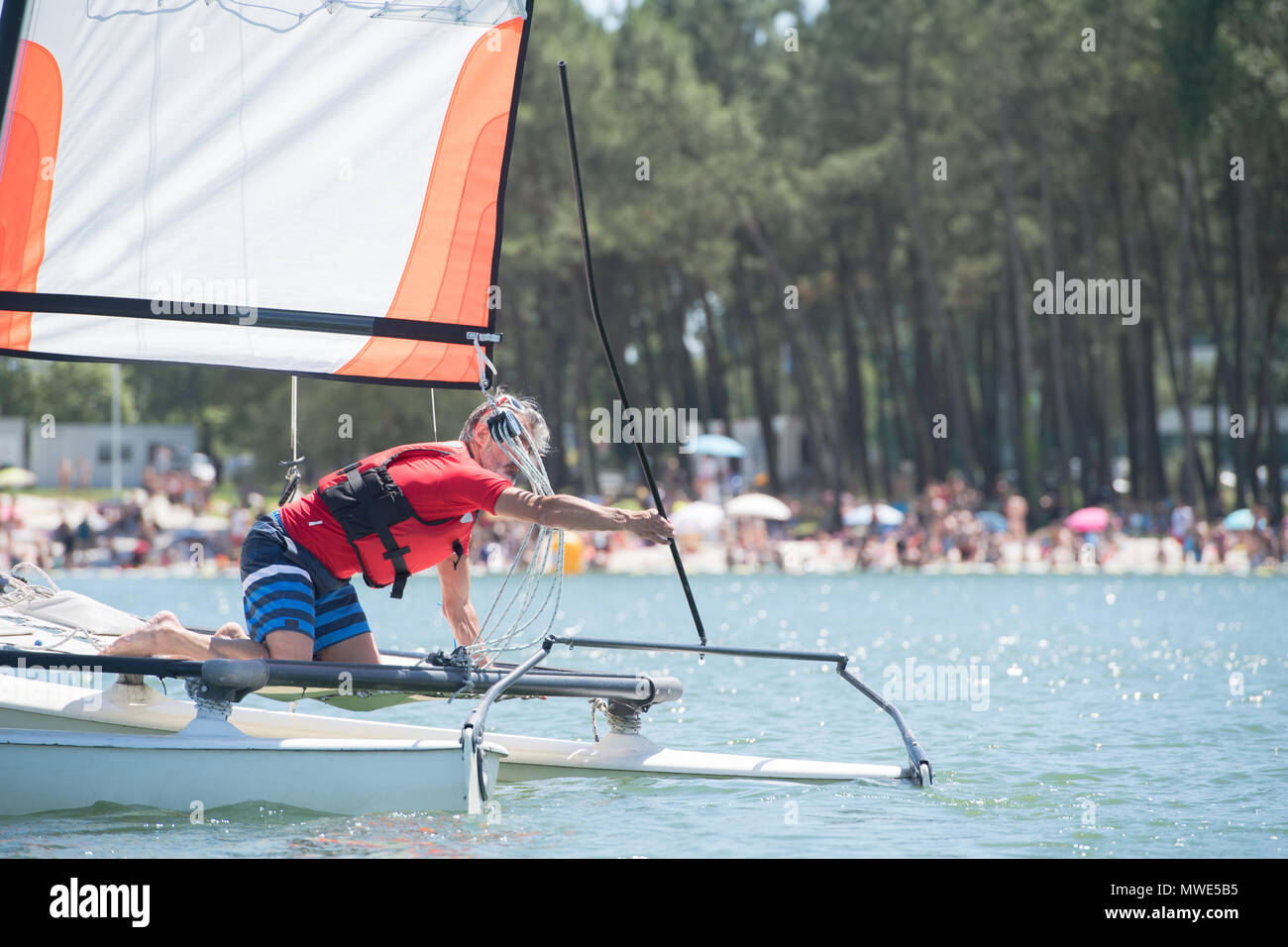 professional waterman training on lake with catamaran Stock Photo - Alamy