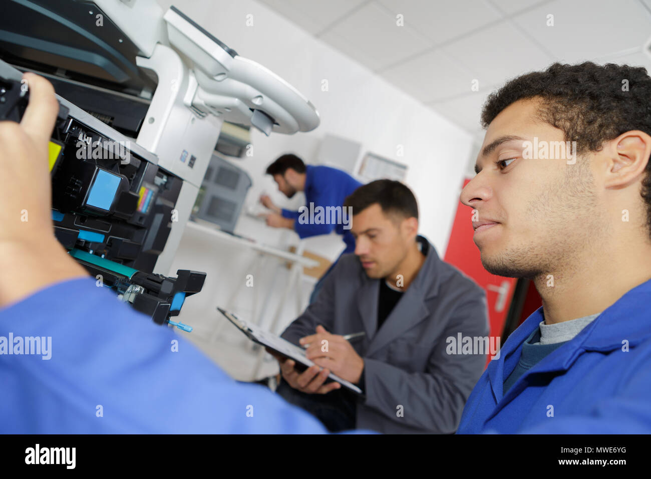 Man Repairing Photocopier High Resolution Stock Photography and Images ...