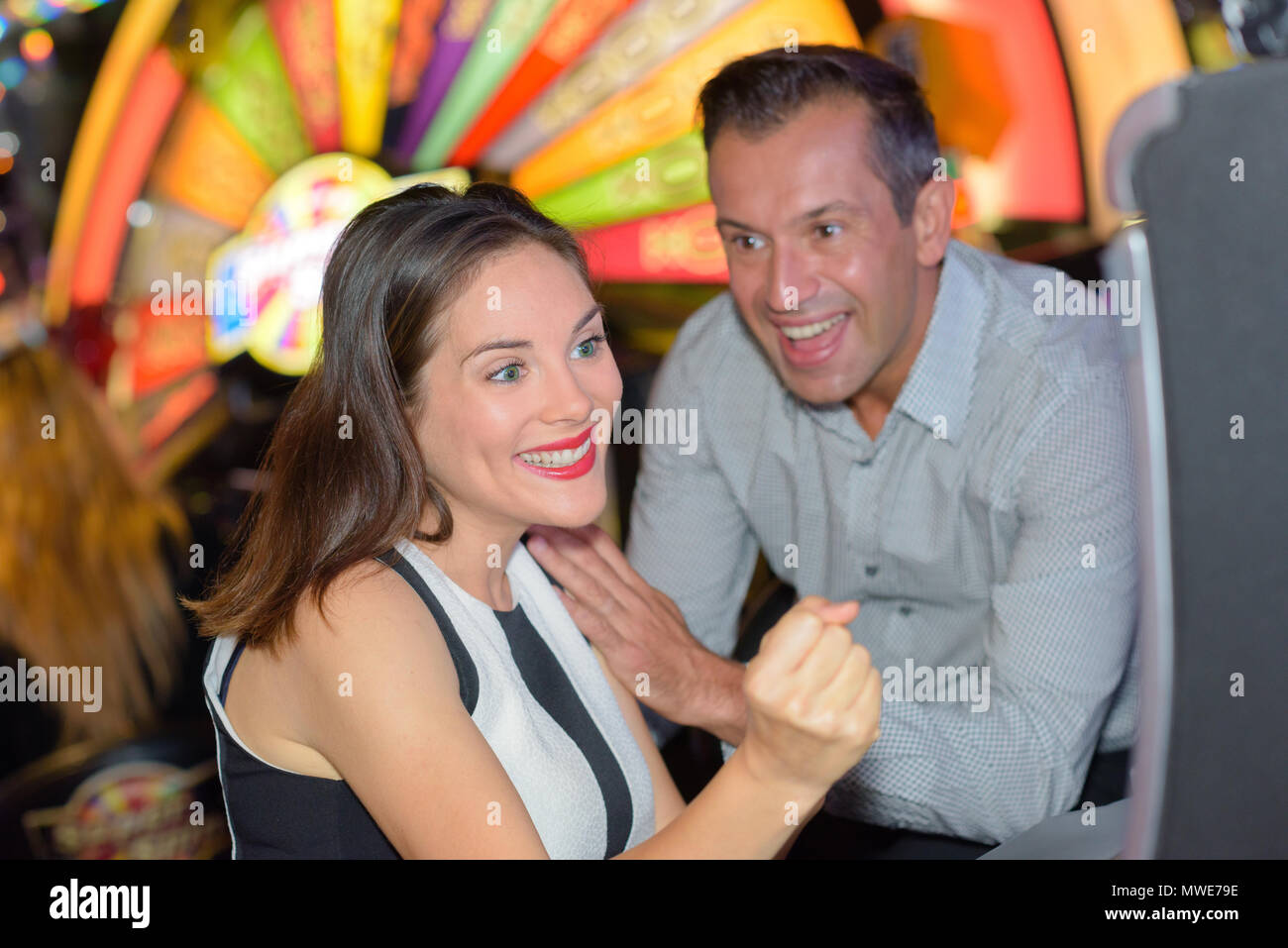 Woman play slot machine hi-res stock photography and images - Alamy