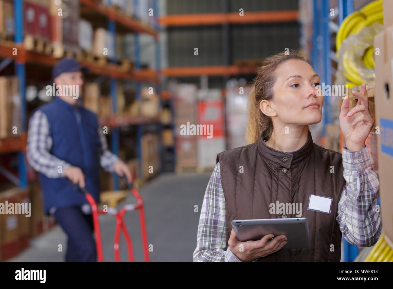 inspecting the products in the warehouse Stock Photo - Alamy