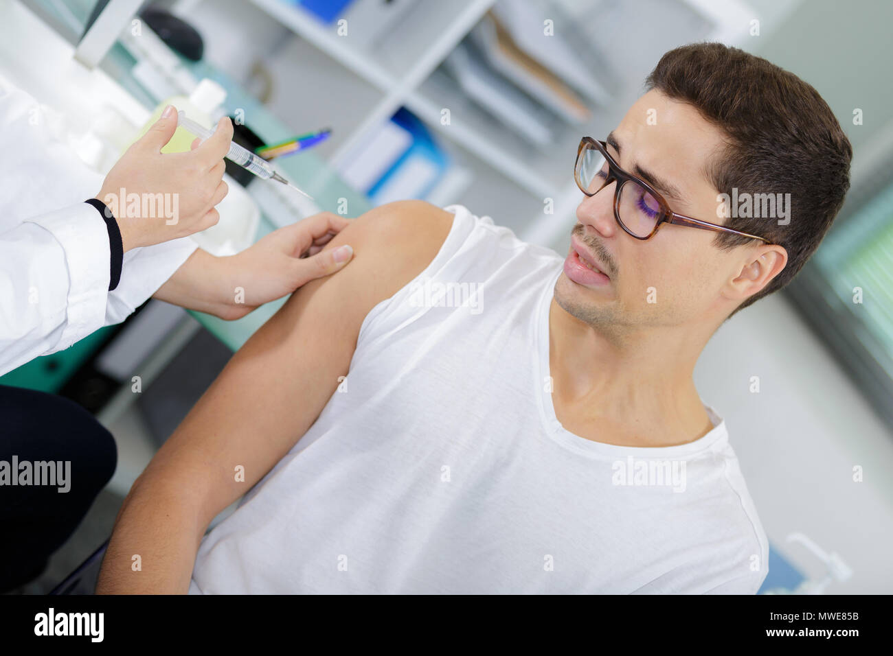 scared young man before injection Stock Photo - Alamy
