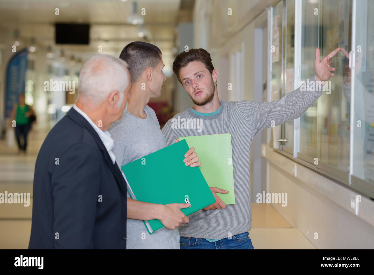 Teacher student talking hallway hi-res stock photography and images - Alamy