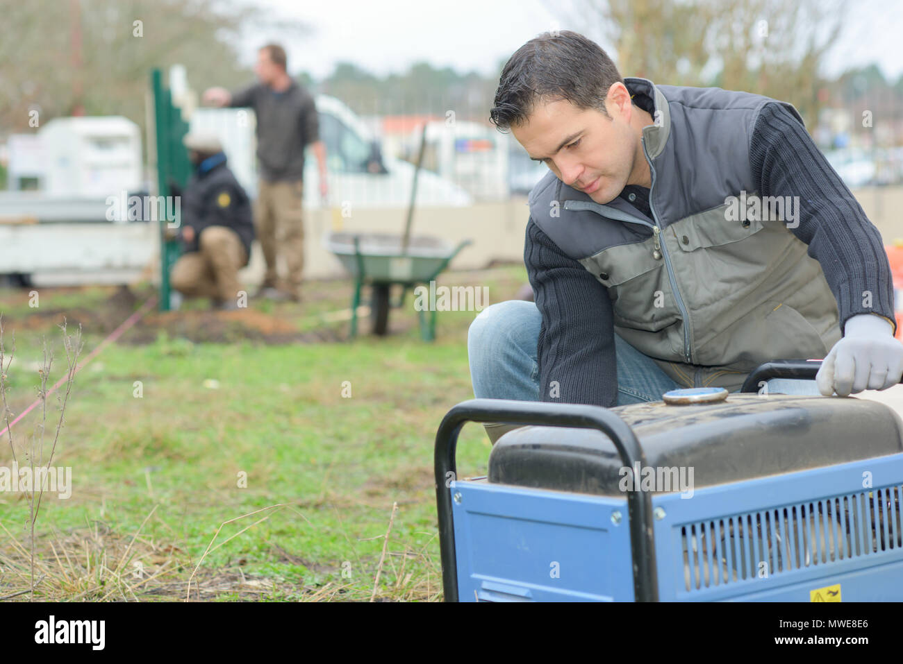 man starting generator Stock Photo - Alamy