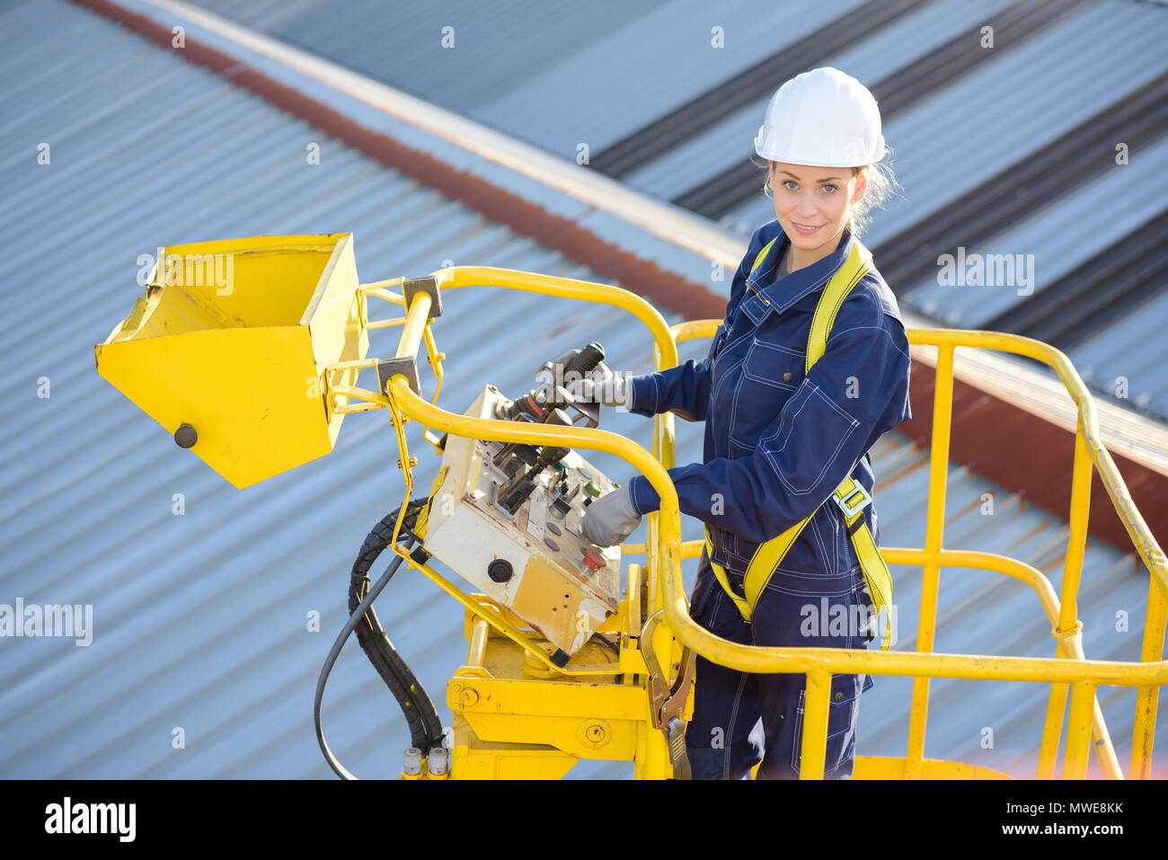 female construction worker on site in hydraulic lifting ramp Stock ...