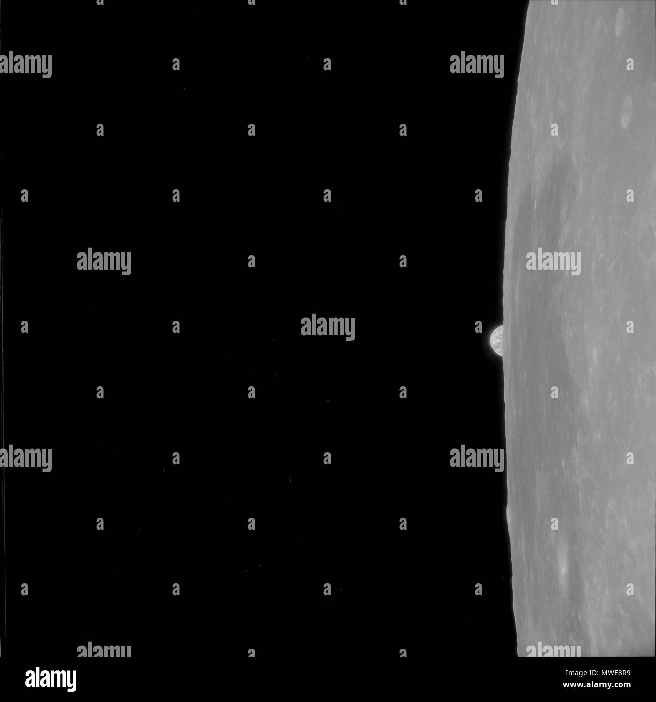 Apollo 11 mission. Lunar orbit with earth in background Stock Photo - Alamy