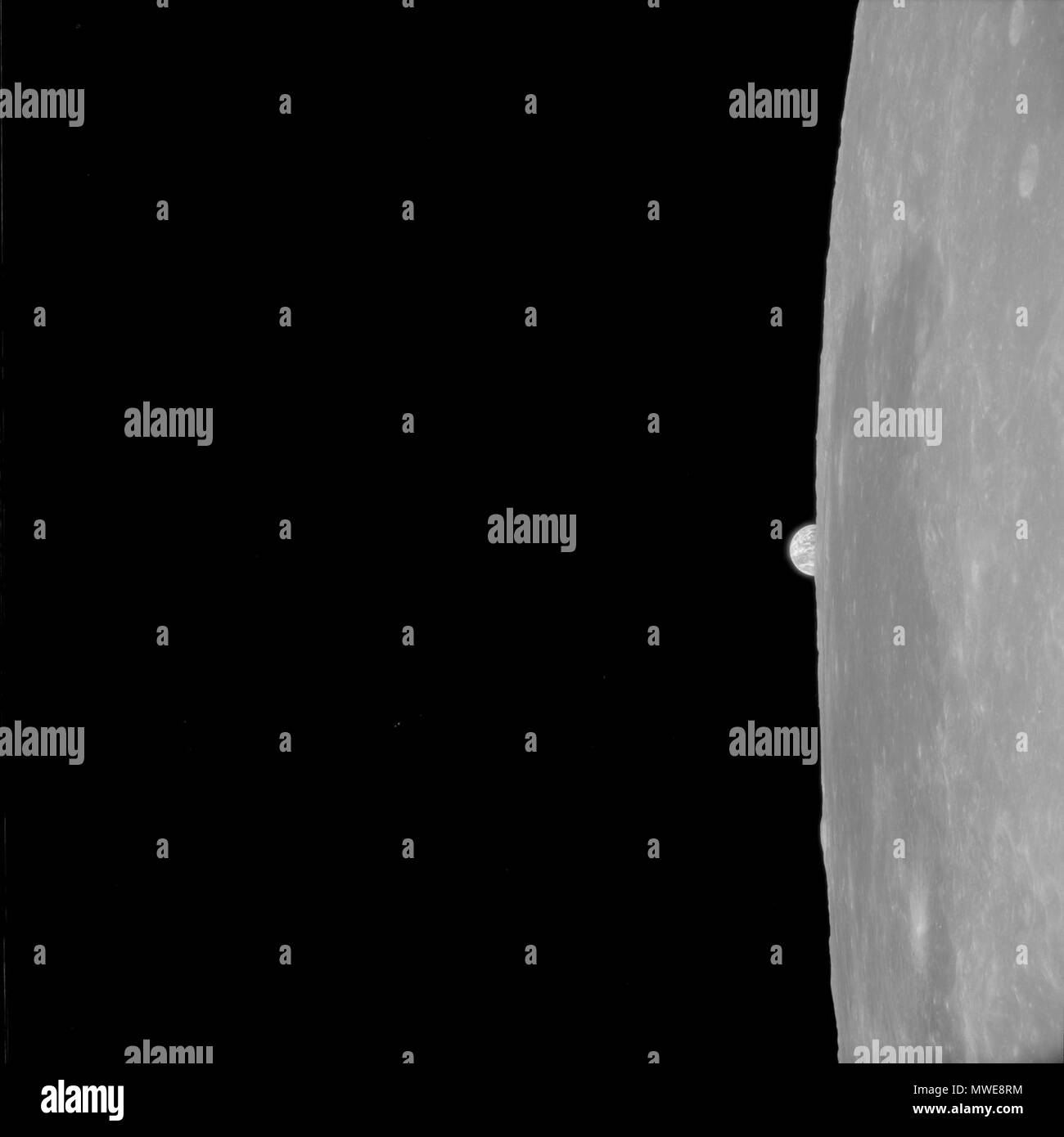 Apollo 11 mission. Lunar orbit with earth in background Stock Photo - Alamy