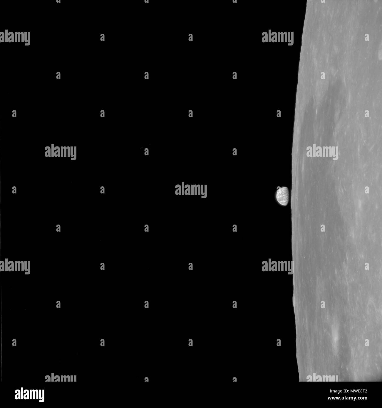 Apollo 11 mission. Lunar orbit with earth in background Stock Photo - Alamy